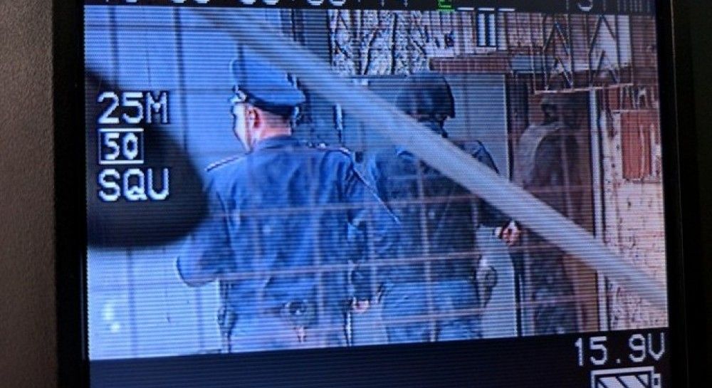 Russian GRU officers taken to court in helmets, bulletproof vests